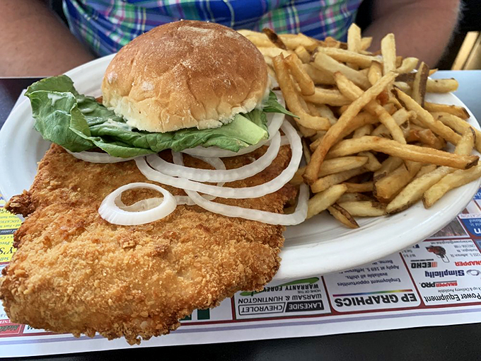 When your sandwich needs its own ZIP code! The tenderloin's crispy edges create a satisfying crunch that echoes through the diner.