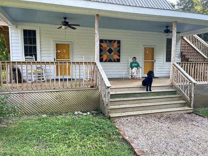 The 1850 Cottage porch&mdash;where rocking chairs and colorful quilt art create the perfect setting for afternoon contemplation.