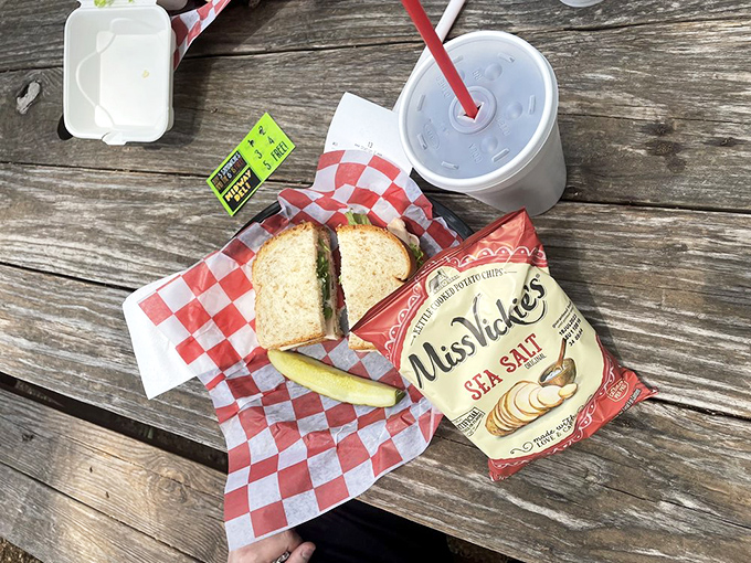 A proper sandwich and cold drink served with Miss Vicki's chips—the holy trinity of lunch perfection. Simple pleasures are often the most profound.