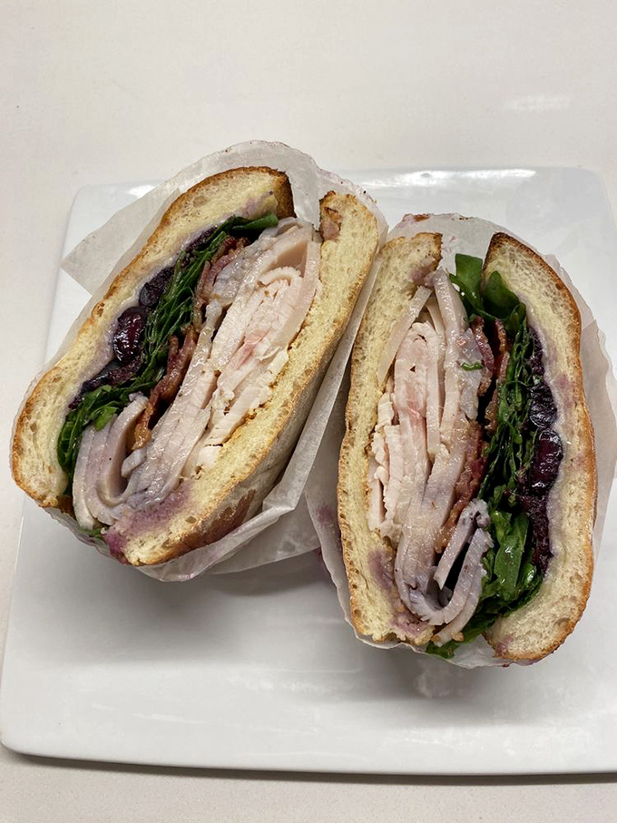 The Surfer Tom sandwich, stacked high with fresh ingredients, makes you wonder why you'd ever settle for a boring desk lunch again. 
