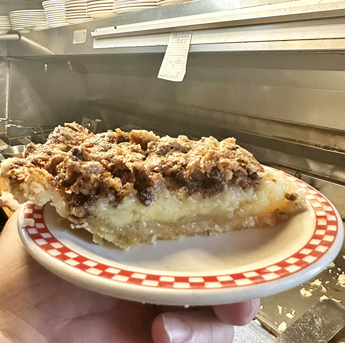 That perfect pie cross-section reveals layers of flavor and texture that would make even your pie-champion grandmother nod in silent respect.