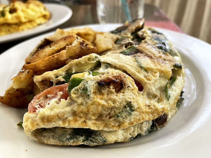 An omelet that actually delivers on the "farm fresh" promise. Those potatoes didn't just show up&mdash;they were invited to this flavor party.