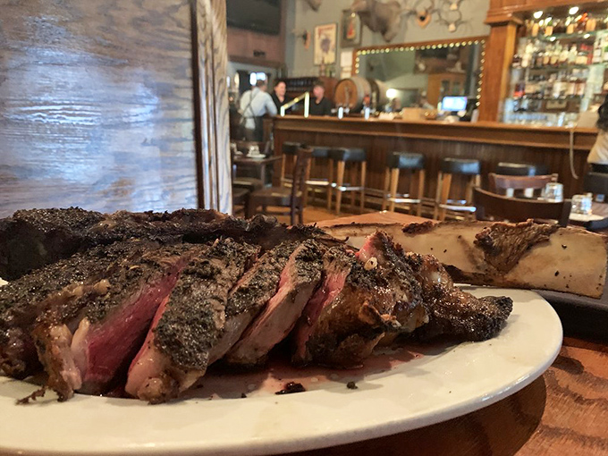 Crystal, glass, and whimsy arranged like a still life from another era. That wicker vanity has definitely seen some stories.