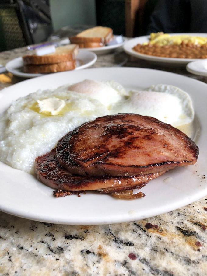 A breakfast plate that speaks Pennsylvania's language—scrapple, eggs with sunshine-yellow yolks, and home fries worth getting out of bed for.