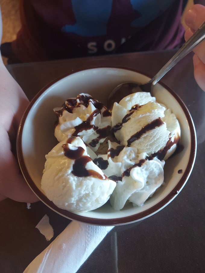 Ice cream and chocolate sauce&mdash;proof that sometimes the simplest pleasures are the most profound, especially when served in a cozy Arkansas hideaway.
