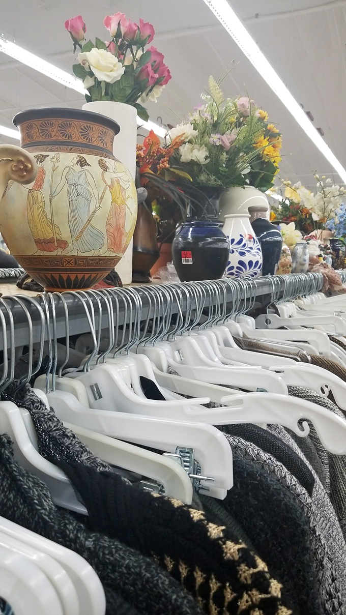 Vases that have outlived several decorating trends sit atop clothing racks&mdash;multitasking shopping at its finest!