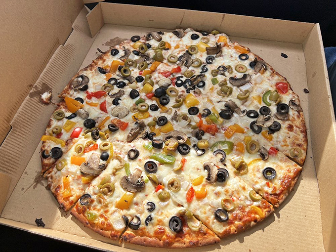 Who knew vegetables could party this hard? Black and green olives, mushrooms, and peppers transform this pizza into a garden of earthly delights.