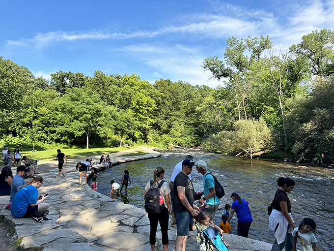 The shallow creek below the falls becomes Minnesota's most popular toe-dipping destination when summer temperatures soar.