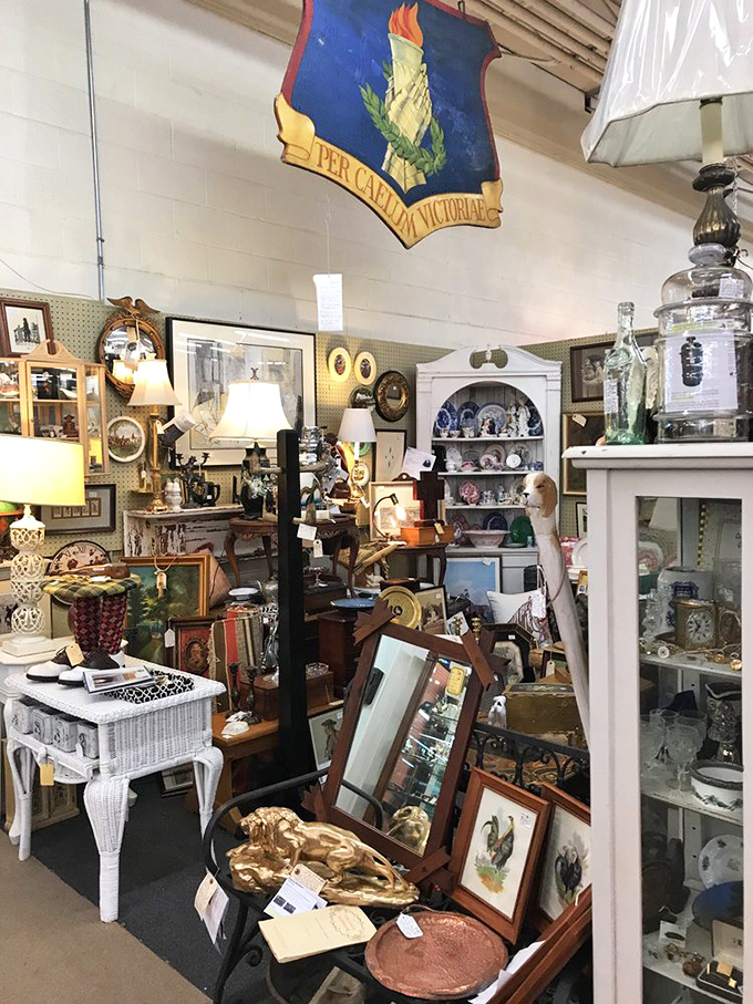 A booth so densely packed with treasures it resembles an elegant game of historical Jenga. One wrong move and you're buried under Victorian splendor.