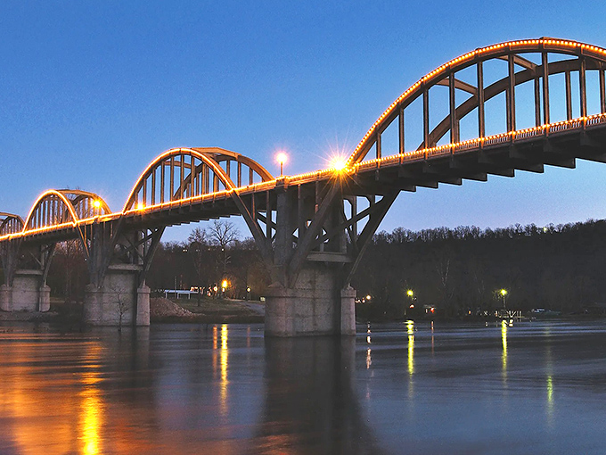 As twilight falls, the bridge's arches transform into a string of pearls against the darkening sky. Romance isn't dead&mdash;it's just hanging out in Cotter.