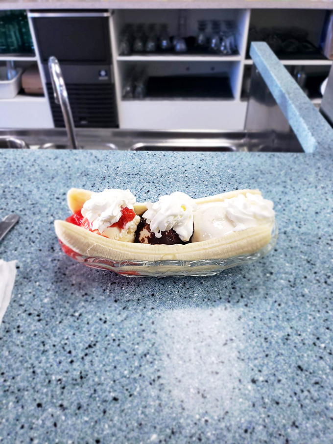 This banana split isn't just dessert, it's architecture&mdash;a carefully constructed monument to the gods of indulgence. 