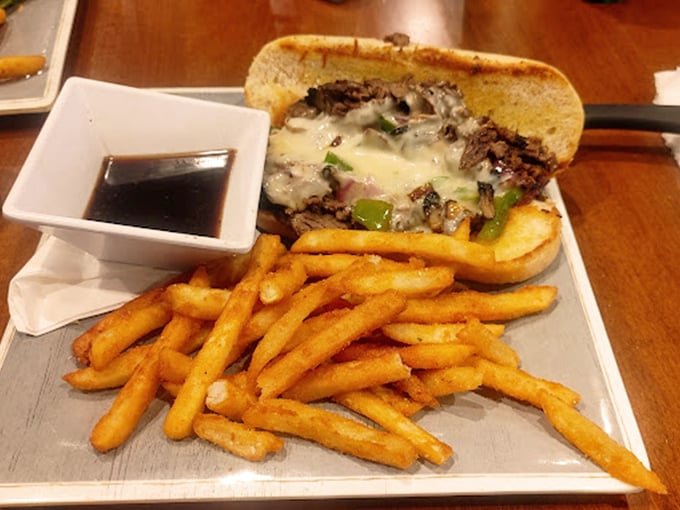 The French dip's melted cheese blanket is doing the Lord's work here. Those fries look like they've achieved the perfect crisp-to-fluffy ratio.