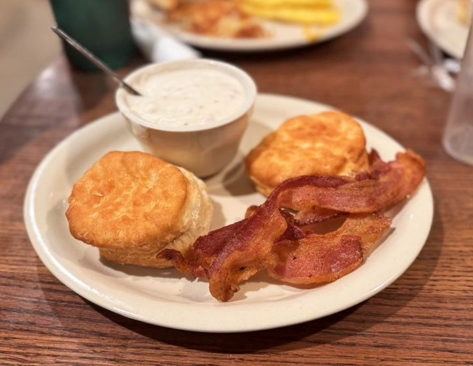 Biscuits and gravy with a side of bacon &ndash; the Southern breakfast trinity that's worth setting your alarm for, even on a Saturday.
