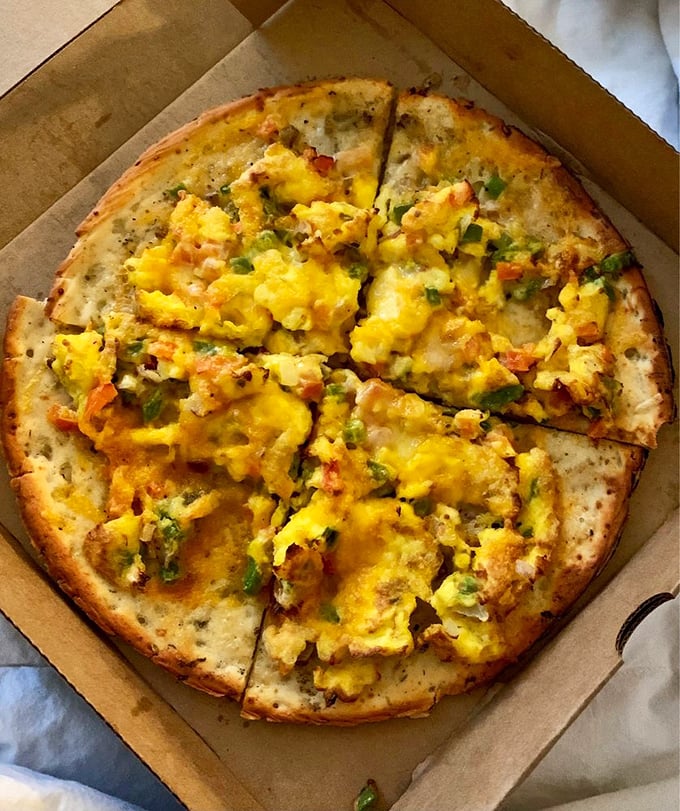 Breakfast pizza proves that circular food can be enjoyed before noon &ndash; eggs and veggies on a crispy crust is morning genius in edible form.