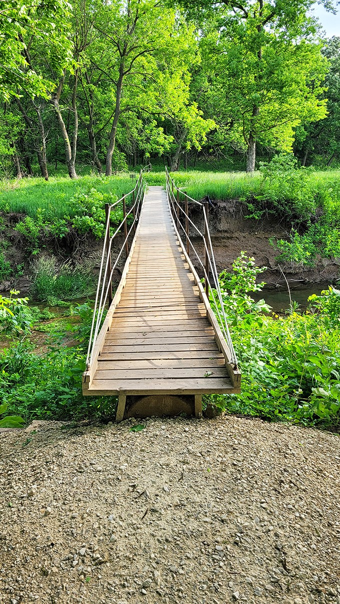 This charming wooden bridge isn't just crossing water—it's crossing time zones between urban stress and rural serenity.