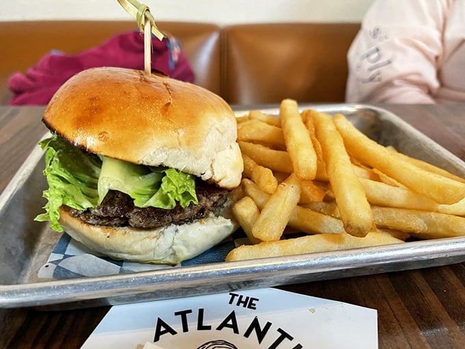 Sometimes you just need a burger. This one, served with golden fries on a metal tray, hits that sweet spot between fancy and familiar.