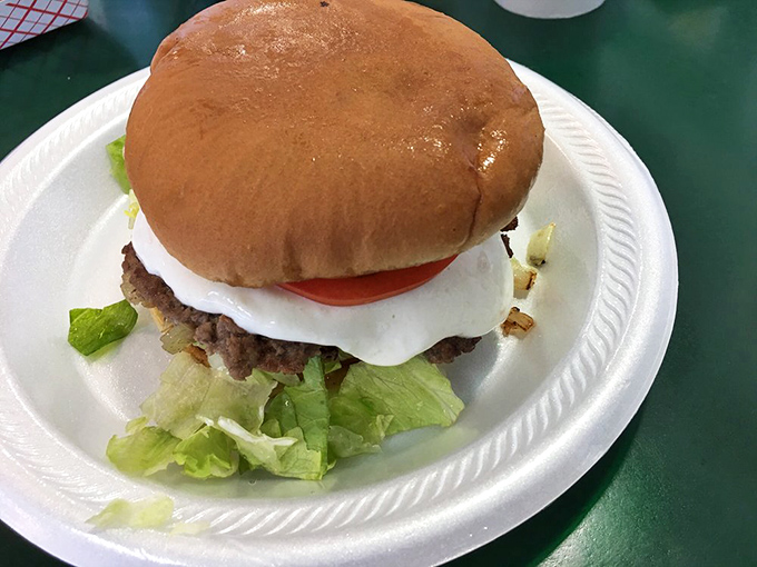 Simple pleasures on a white plate. This burger doesn't need fancy aioli or artisanal buns to make your taste buds stand at attention.