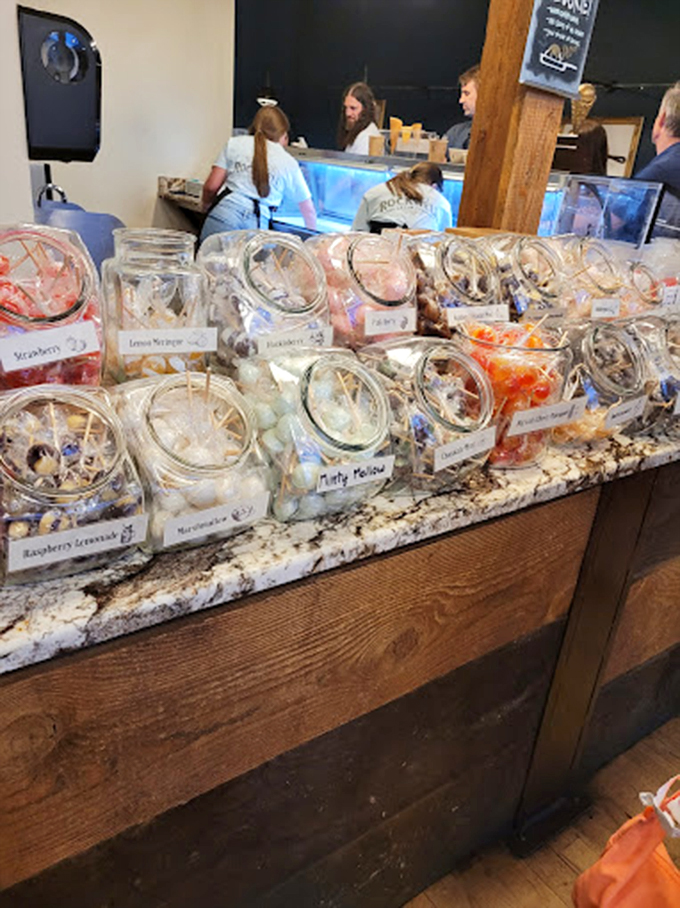 Mason jars filled with colorful candies line the counter like a sweet apothecary, each labeled with the cure for whatever ails you. 