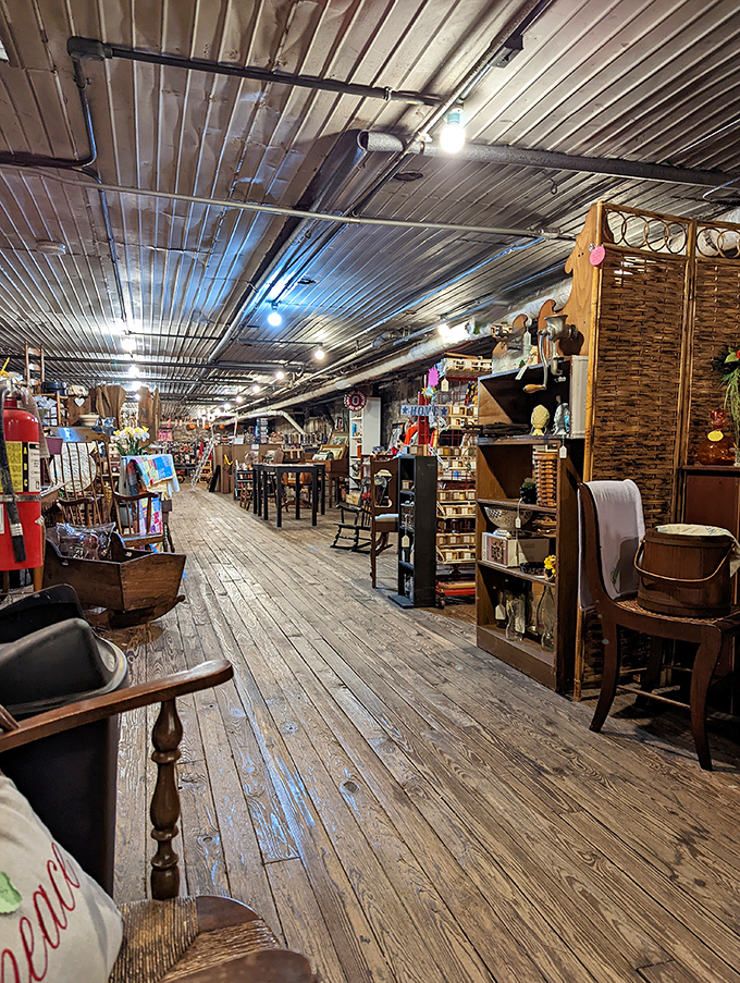 Weathered wooden floors stretch toward infinity, flanked by vintage furniture and collectibles arranged like exhibits in a museum of everyday life.