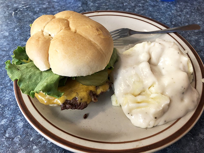 The cheeseburger and mashed potatoes combo—where lunch meets comfort in a dance as old as the American diner itself.