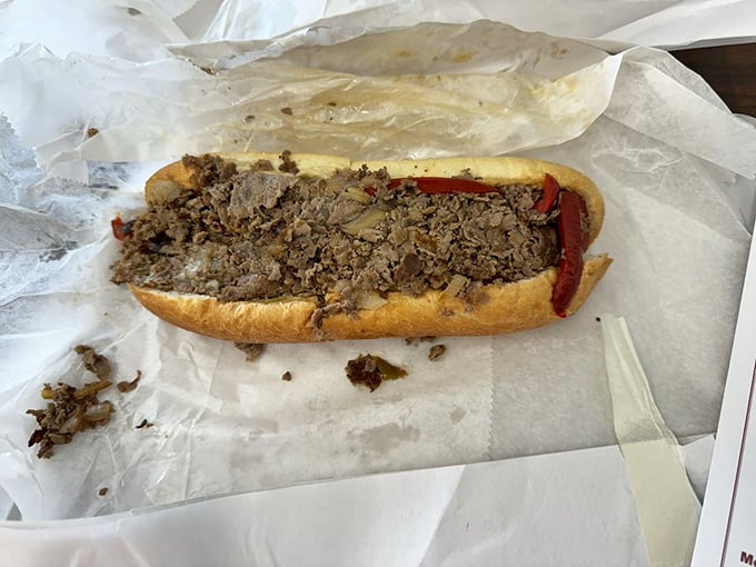 The cheesesteak in its natural habitat &ndash; thinly sliced beef nestled in a pillowy roll, waiting to transport you to comfort food nirvana.