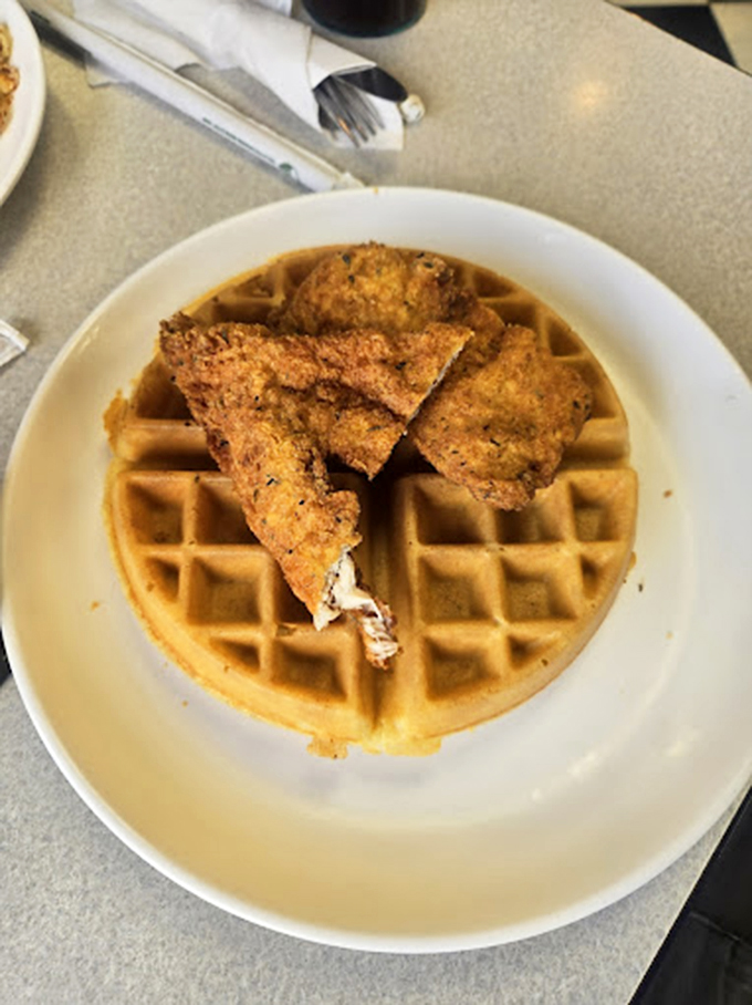 The ultimate sweet-savory romance: golden waffle meets crispy chicken in a partnership more harmonious than Simon and Garfunkel.