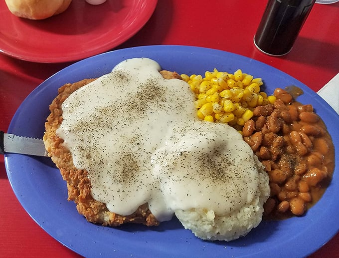 Country-fried steak smothered in gravy with a side of beans&mdash;Southern comfort that hugs your insides like a warm blanket.