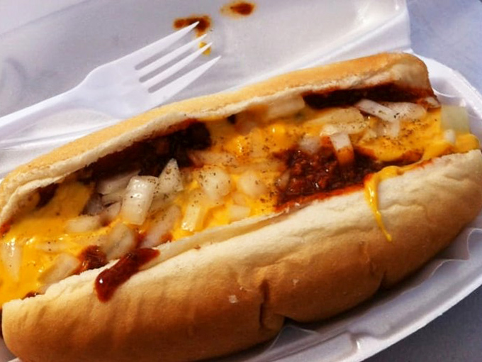 The chili cheese dog—where molten cheddar meets savory chili in a relationship so perfect it should have its own reality show.