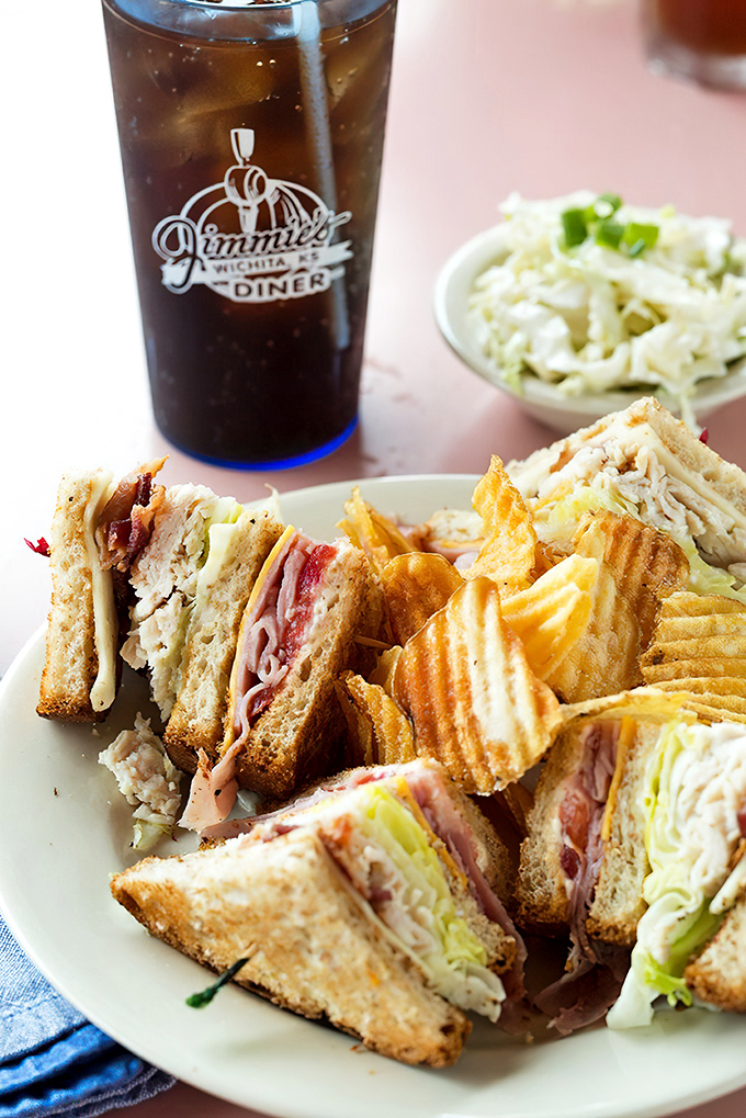 This club sandwich isn't messing around&mdash;stacked higher than Kansas wheat with layers that tell a delicious story in every bite.