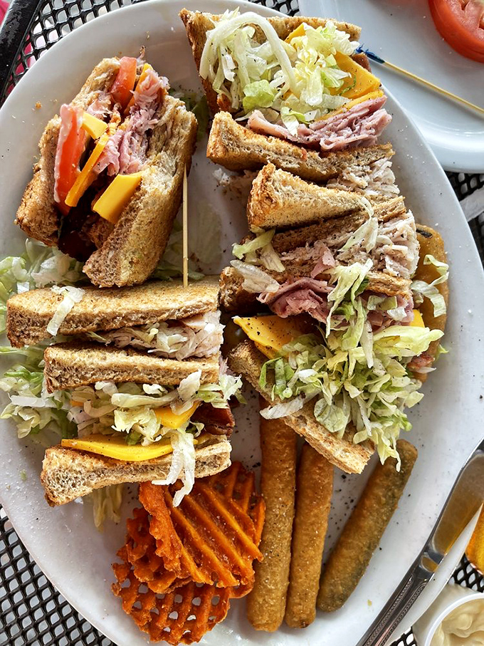 The architectural marvel that is the club sandwich&mdash;a skyscraper of turkey, bacon, and veggies where each floor offers new delights. Those waffle fries didn't come to play!