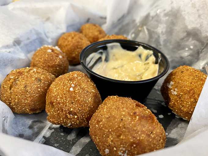 Hush puppies that look like they've been kissed by the deep-fryer gods. Crispy outside, fluffy inside&mdash;the way comfort food should be.