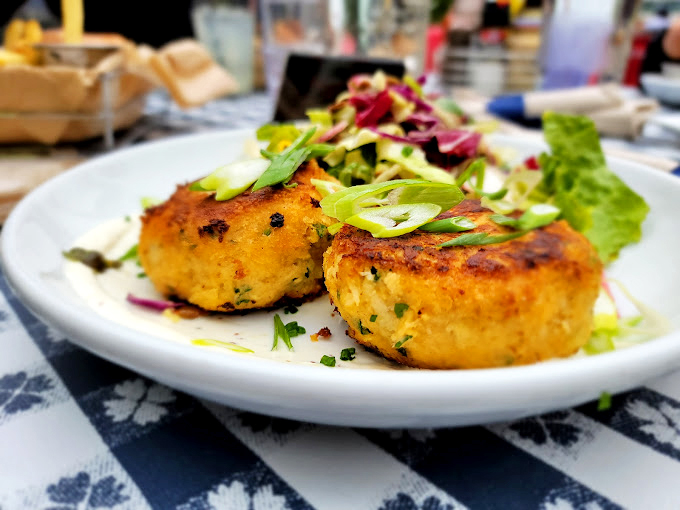 These golden-hued crab cakes are what happens when the ocean's best gets the respect it deserves. Just enough herbs to make the crab sing.