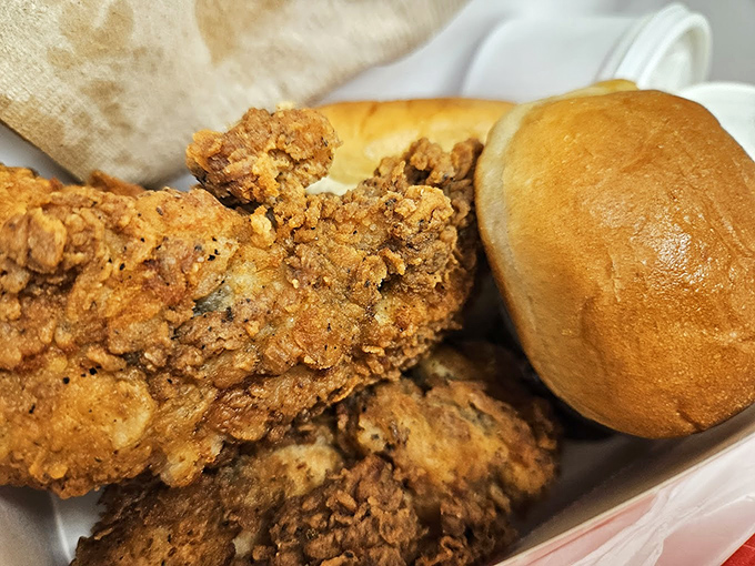The holy trinity: crispy chicken, fresh roll, and the promise of a meal that won't let you down. Comfort food credentials that can't be questioned.
