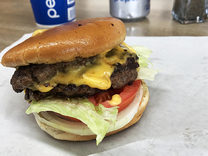 Behold the double cheeseburger in all its glory&mdash;where cheese cascades like a dairy waterfall over perfectly seared beef patties.