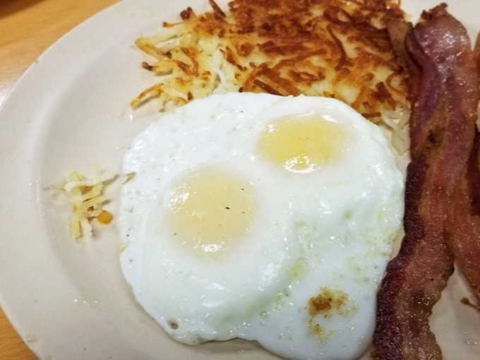 Eggs fried to that magical sweet spot where the whites are set but the yolks remain liquid gold &ndash; nature's perfect sauce for those crispy hash browns.