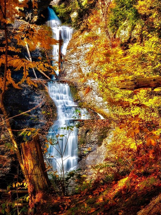 Three tiers of tumbling water create nature's ultimate sound machine. The falls cascade with hypnotic rhythm, each droplet part of a performance that's been running for millennia. 