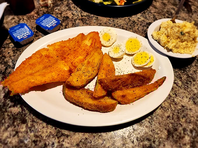 Who knew fish and eggs could be such perfect companions? These seasoned potato wedges aren't just side characters&mdash;they're stealing scenes on this plate.