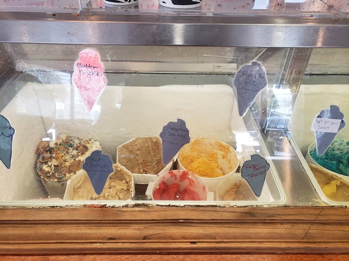 Behind glass, tomorrow's flavors wait their turn&mdash;each handwritten sign promising a different path to happiness. 