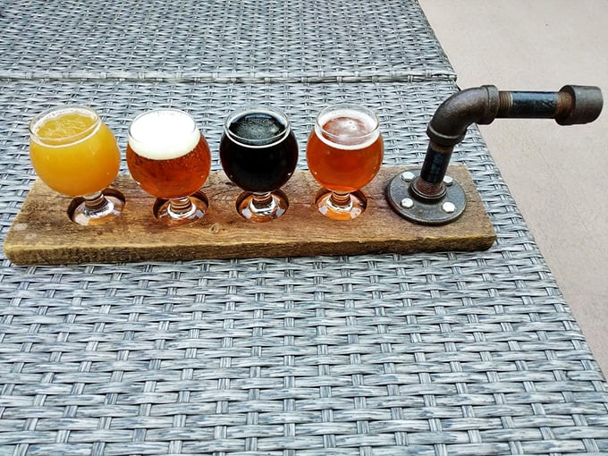 When beer becomes art: this wooden flight paddle transforms sampling into a ceremonial experience. The industrial pipe handle? Pure Minnesota ingenuity.