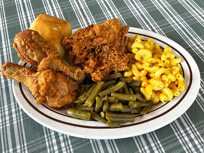 Golden-brown fried chicken, mac and cheese, green beans, and a roll &ndash; the kind of plate that makes dietitians weep and grandmothers proud.