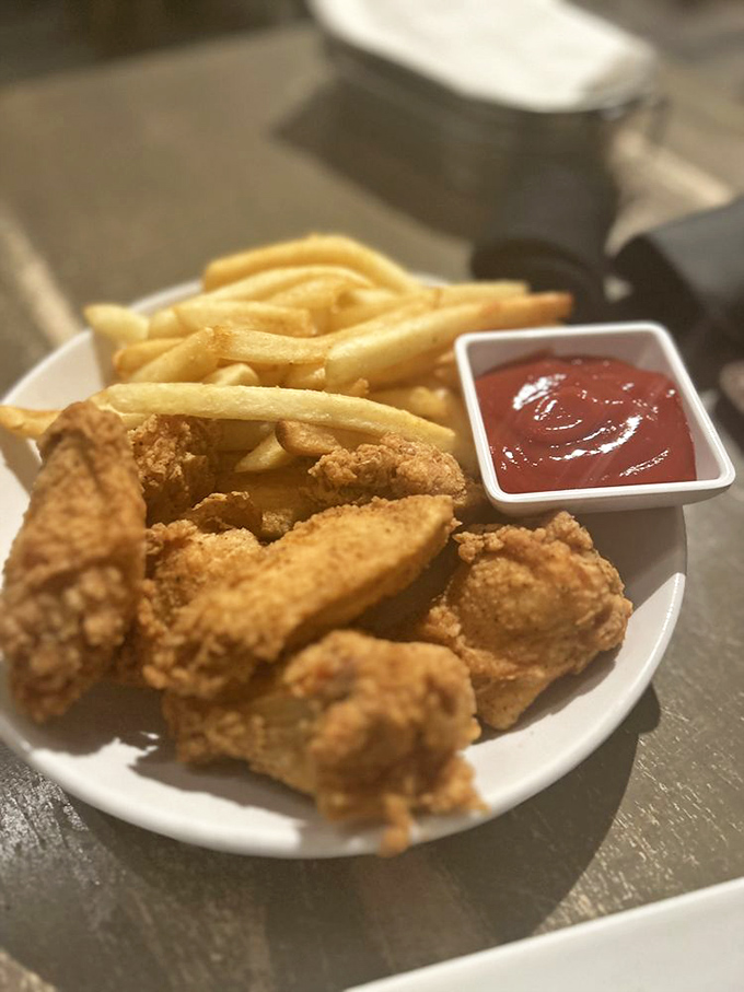 Southern comfort meets culinary finesse. These golden strips of chicken pair perfectly with hand-cut fries and that tangy sauce for dipping.