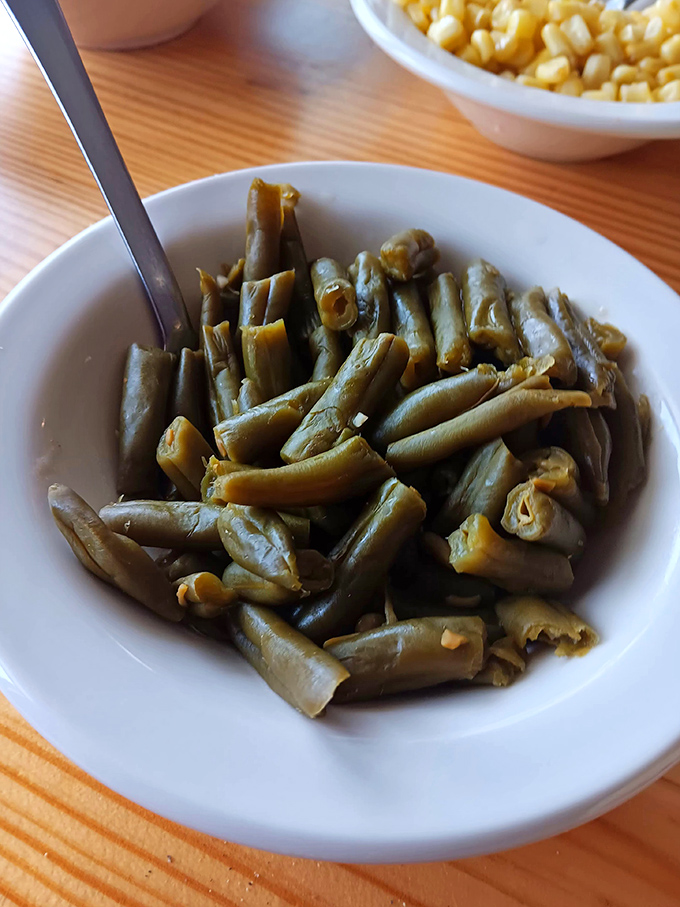 These green beans weren't rushed from farm to table; they took their time, absorbing flavor from ham hocks along their journey.