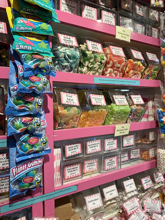 Sour belts and gummy creatures arranged in a Technicolor display that would make Willy Wonka himself nod in professional approval.