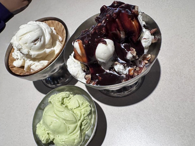 The holy trinity of frozen delights: vanilla parfait, hot fudge sundae with all the fixings, and mint chip that glows with natural color.