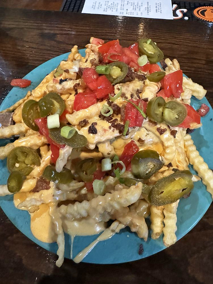 Jalape&ntilde;os and tomatoes add a splash of color and kick to this horseshoe, turning comfort food into an adventure sport for your mouth.