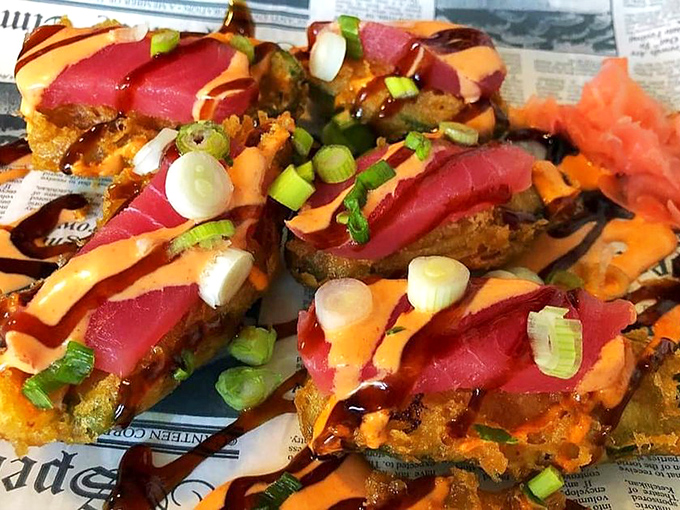 These vibrant tuna bites perched atop crispy wonton chips aren't just appetizers&mdash;they're edible works of art that disappear far too quickly.
