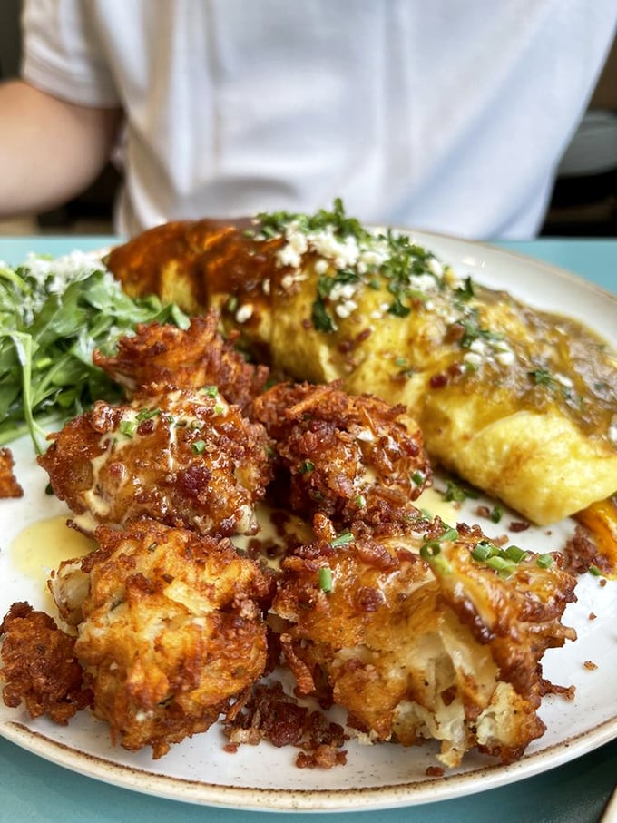 Crispy cauliflower meets fluffy omelet in a plate that proves vegetables can absolutely steal the breakfast show.