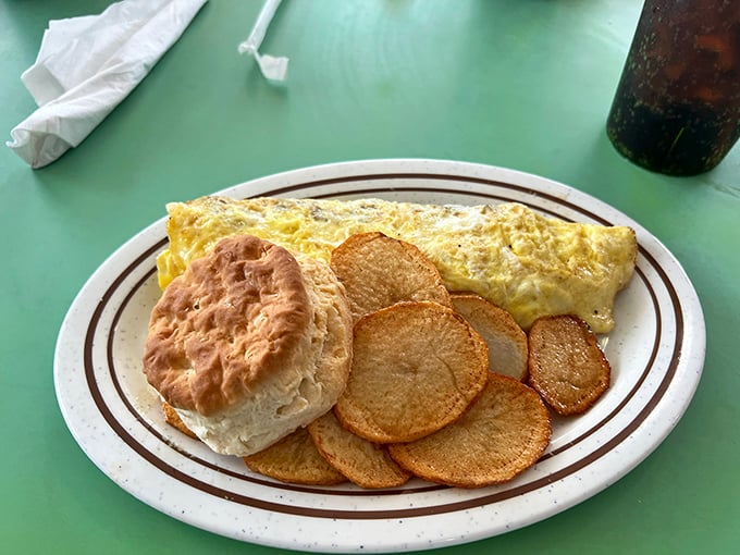 An omelet that knows its purpose in life&mdash;to cradle melted cheese and fillings while flanked by hash browns crisped to golden perfection.