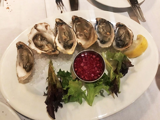 Fresh oysters on ice&mdash;nature's perfect appetizer, where the ocean meets a splash of mignonette in briny harmony.