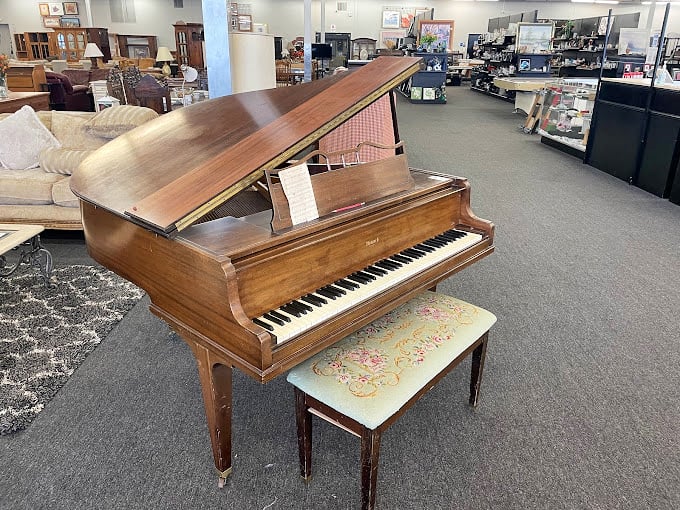 This grand piano isn't just furniture; it's waiting for its second act. Imagine the Chopsticks and Beethoven it's already witnessed.